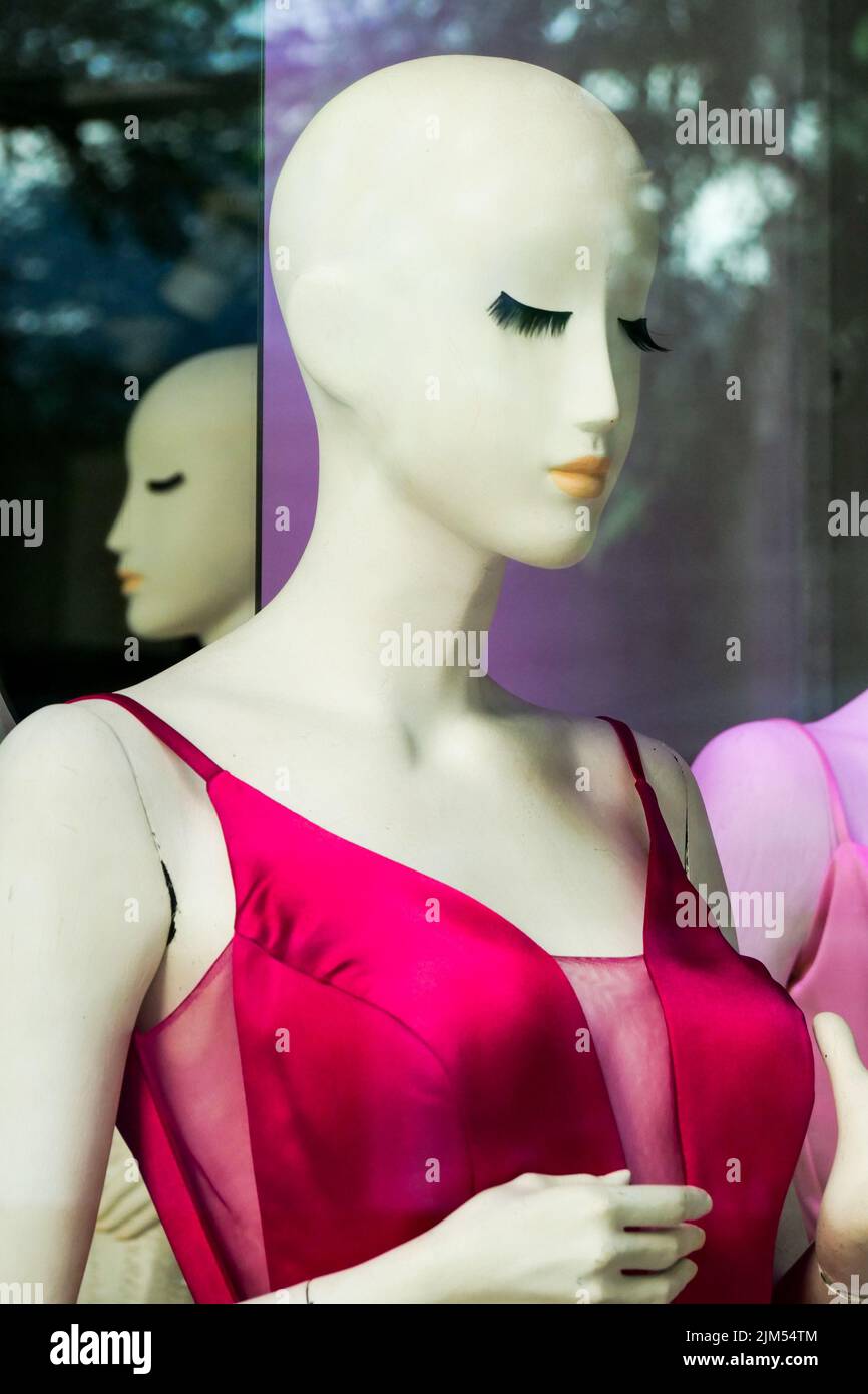 Female manikin exposed in the shopwindow of a fashion shop ...