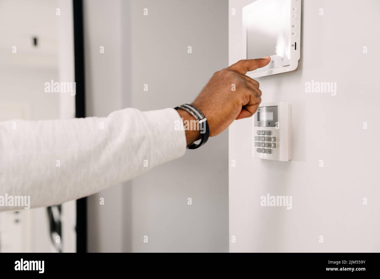 Black man's hand opening door with security code at home Stock Photo - Alamy