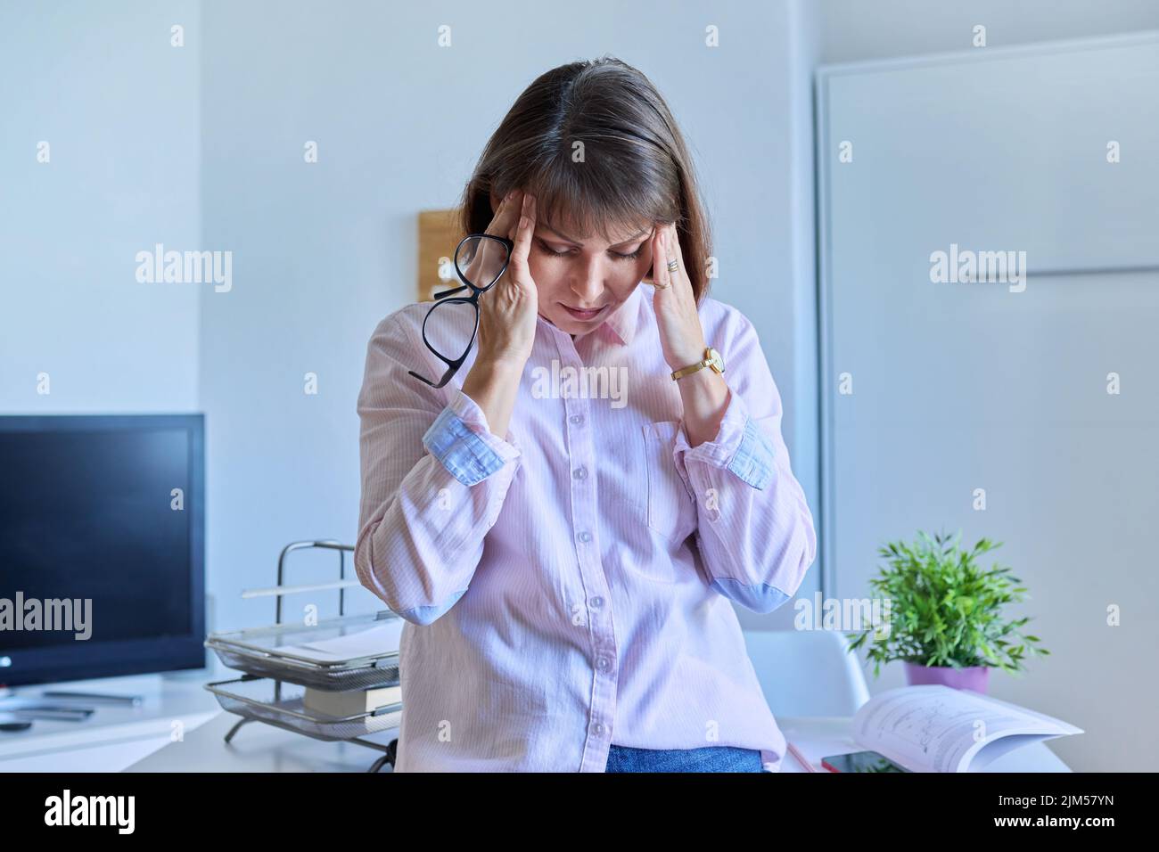 Mature tired woman experiencing stress headache depression Stock Photo ...
