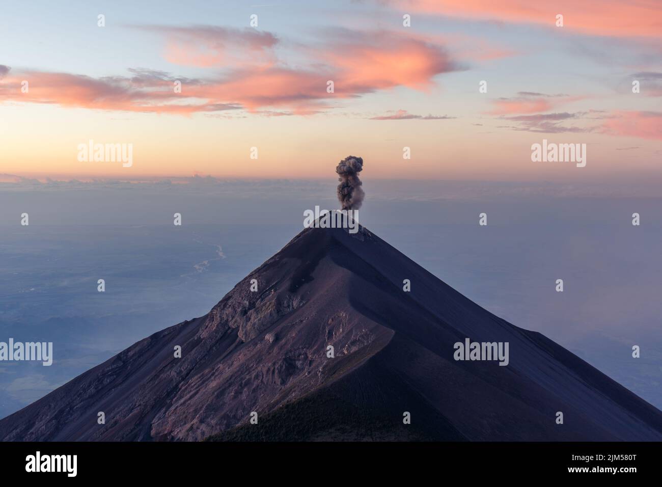 Volcano de fuego exploding with cloud of smoke at sunrise seen from the ...