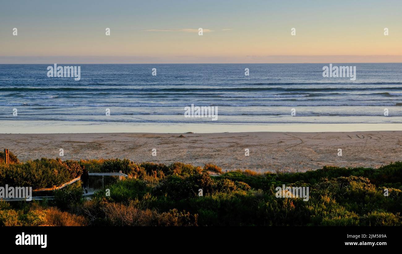 A panoramic view of the wavy beach Stock Photo - Alamy