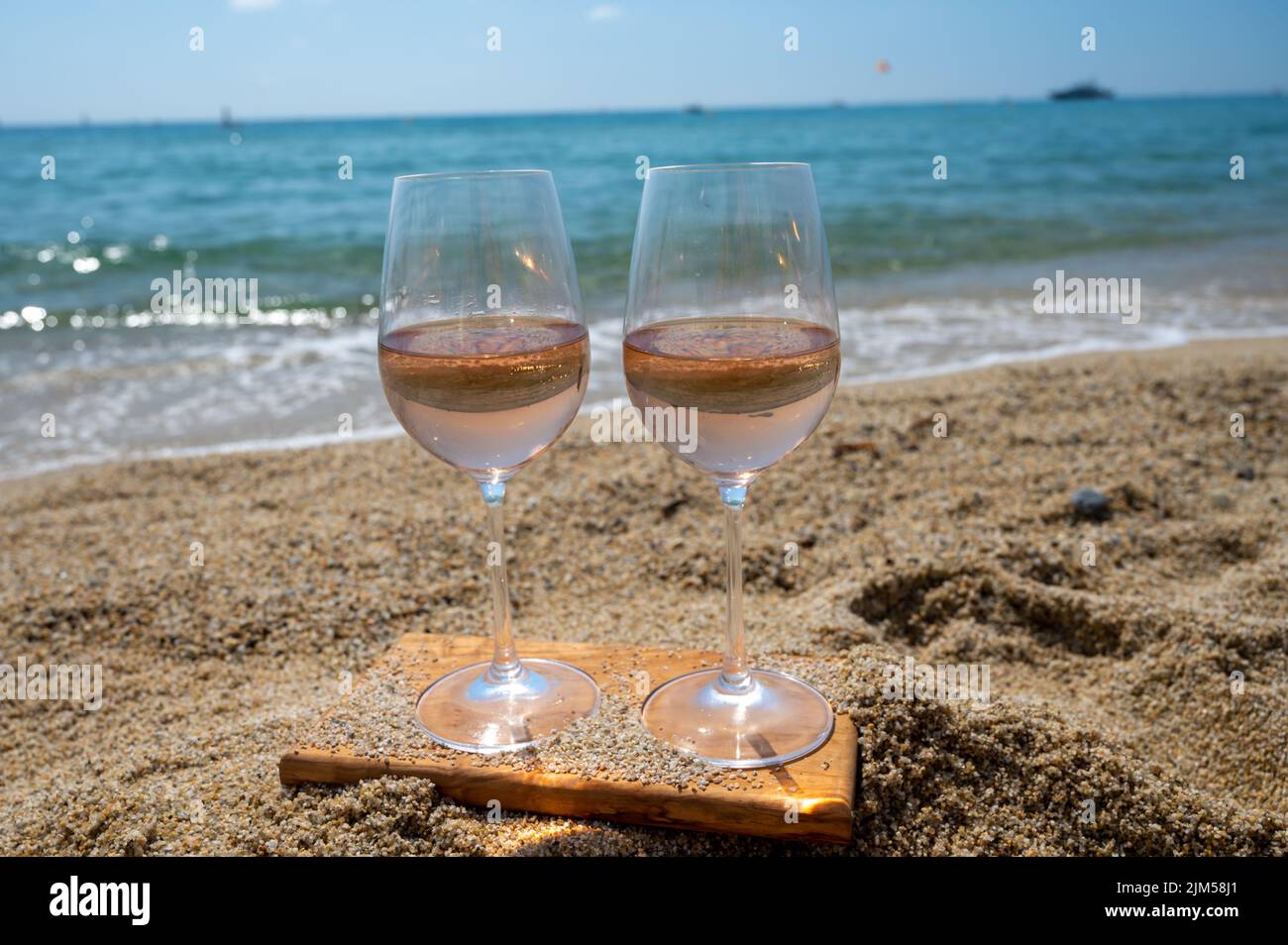 Cold rose wine from Provence served outdoor on white sandy beach Plage ...