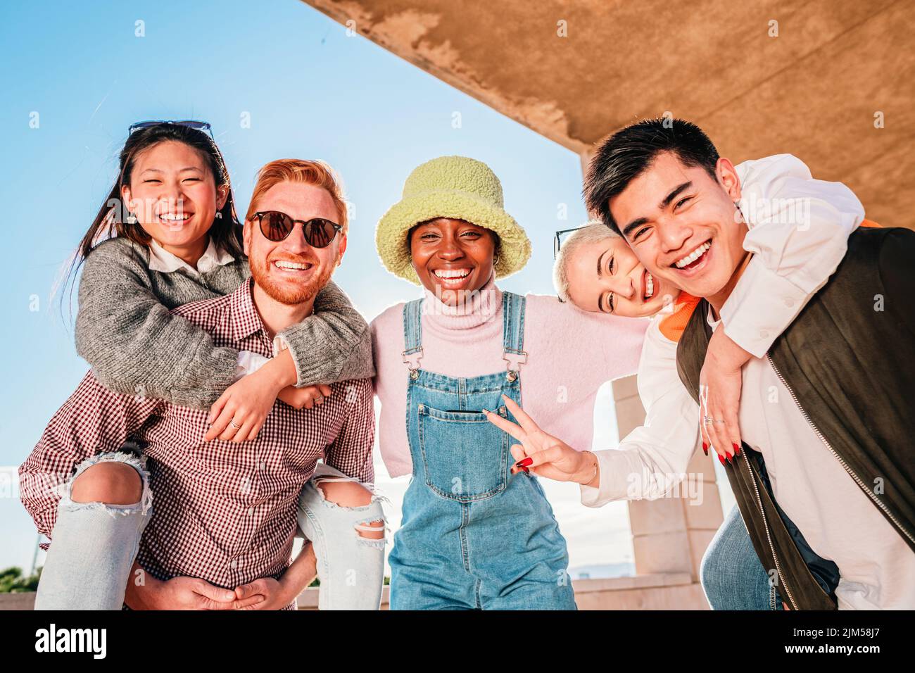 Group of five happy young friends having fun together adn smiling Stock ...