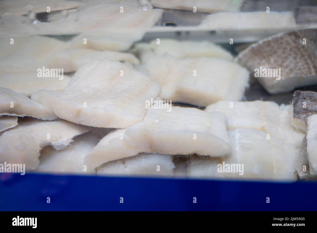 White salted and dried bacalao codfish in watertank, traditional ...