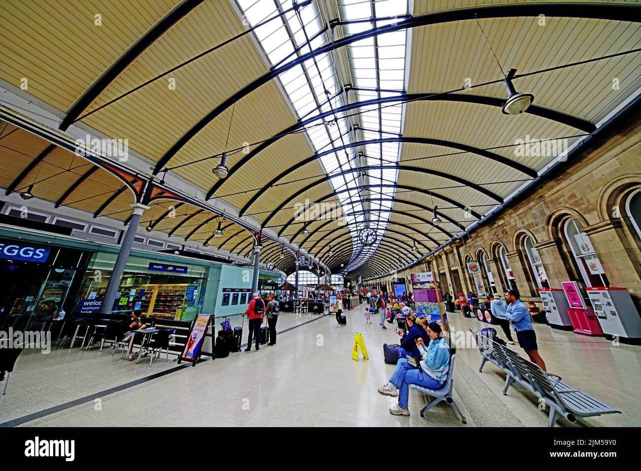 Newcastle Central Rail Station platforms amid cafes with waiting ...
