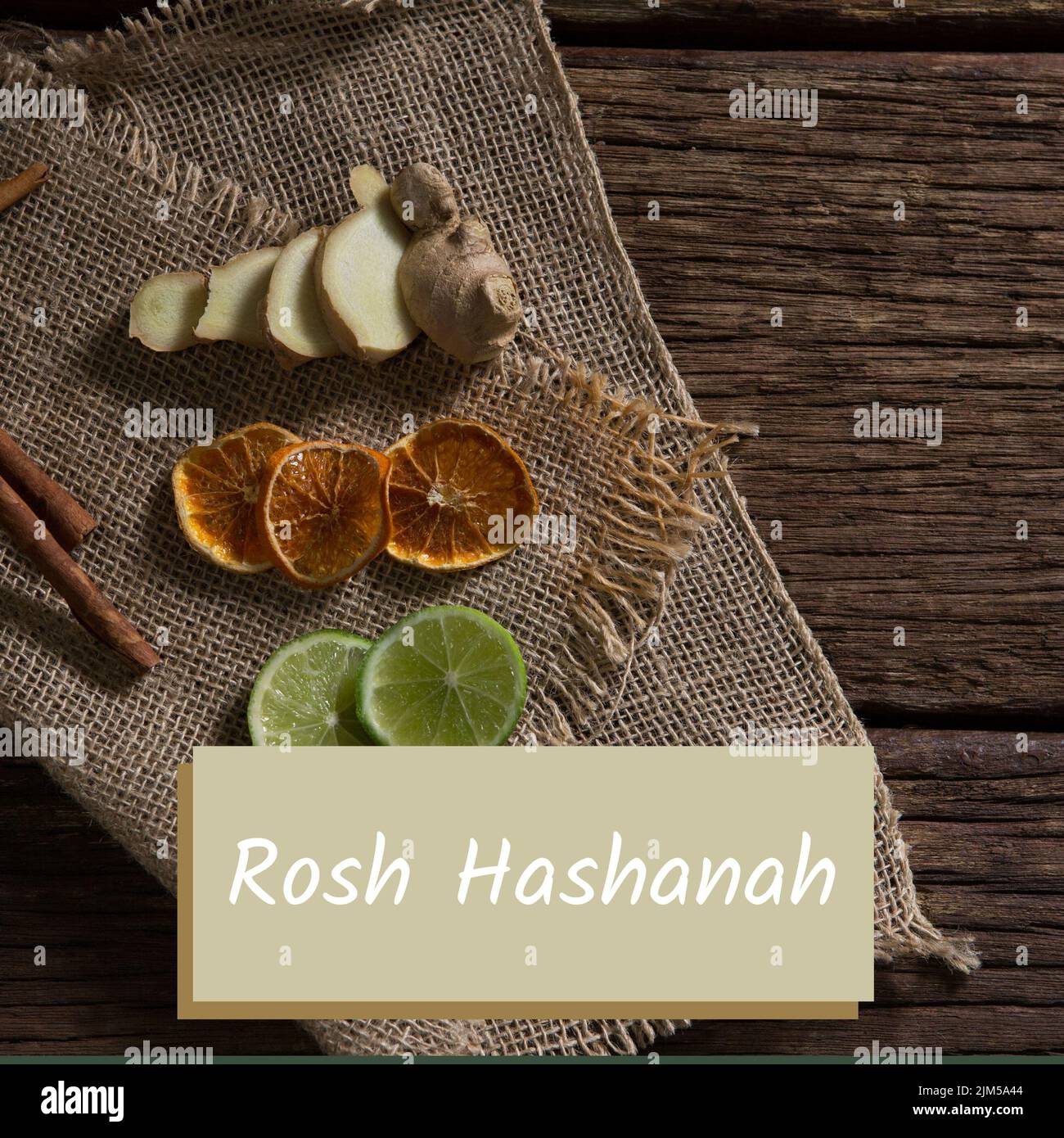 Composite of rosh hashanah text with ginger, lemon, lime slices and ...