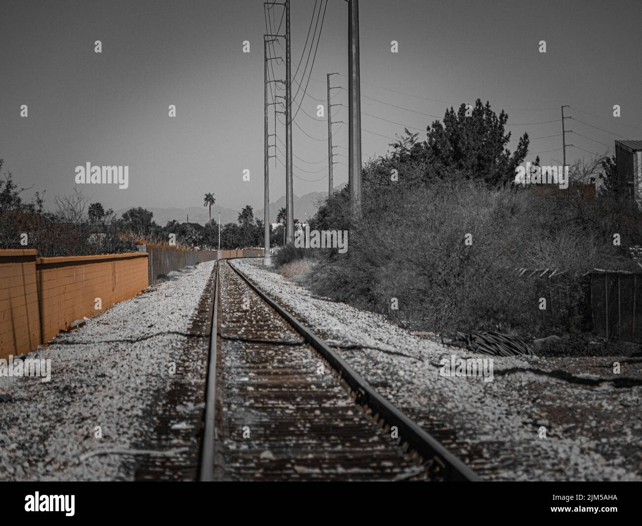 An empty railroad track captured on a gloomy day in the countryside ...