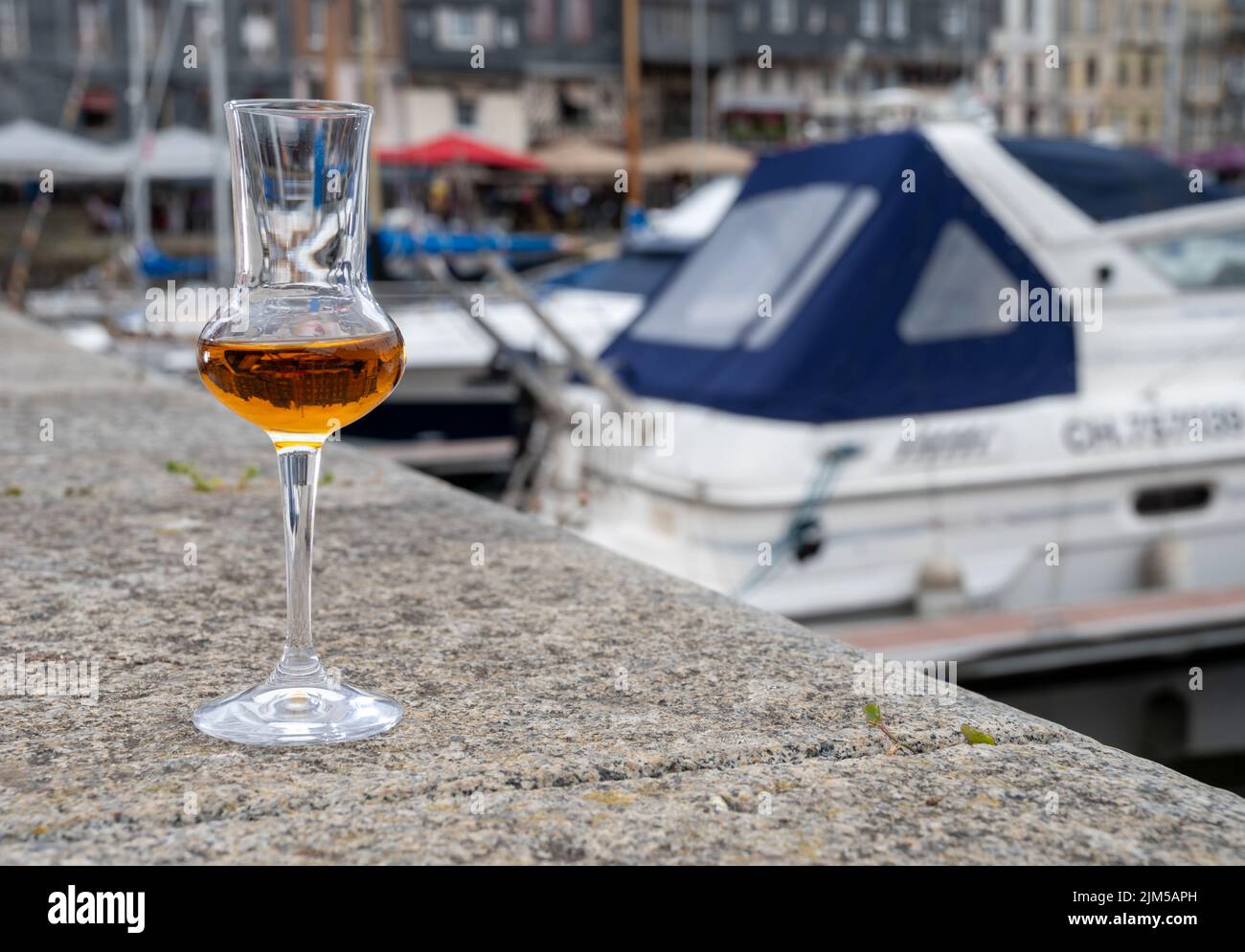 Tasting of apple calvados drink from glasses in old Honfleur harbour ...