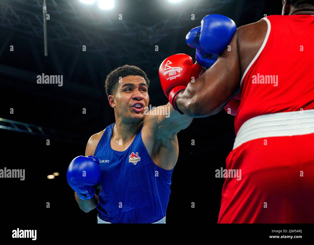 England's Delicious Orie (Blue) and Trinidad and Tobago's Nigel Paul ...