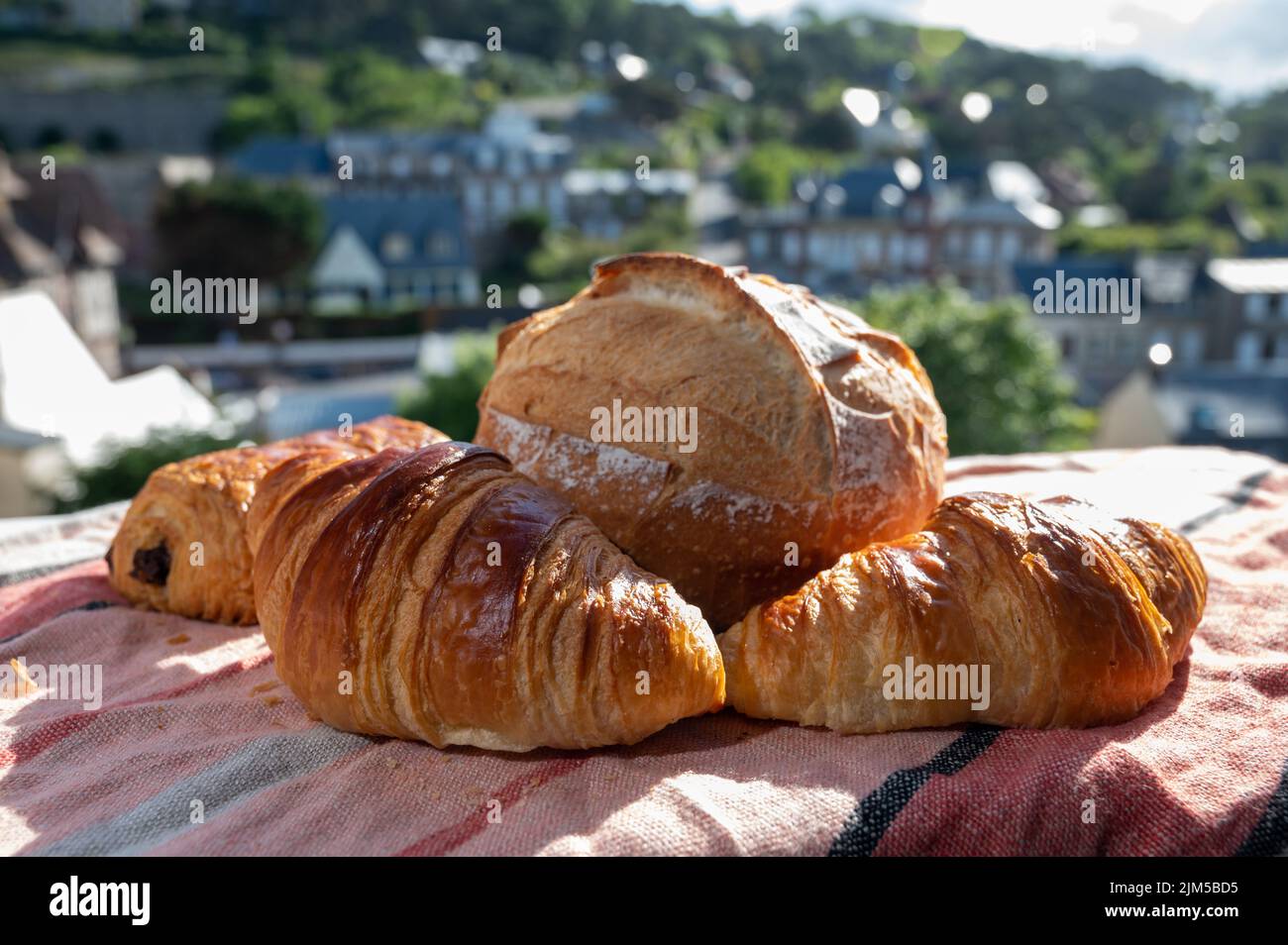 Two fresh baked butter croissants and whitre wheat farmers breasd from ...