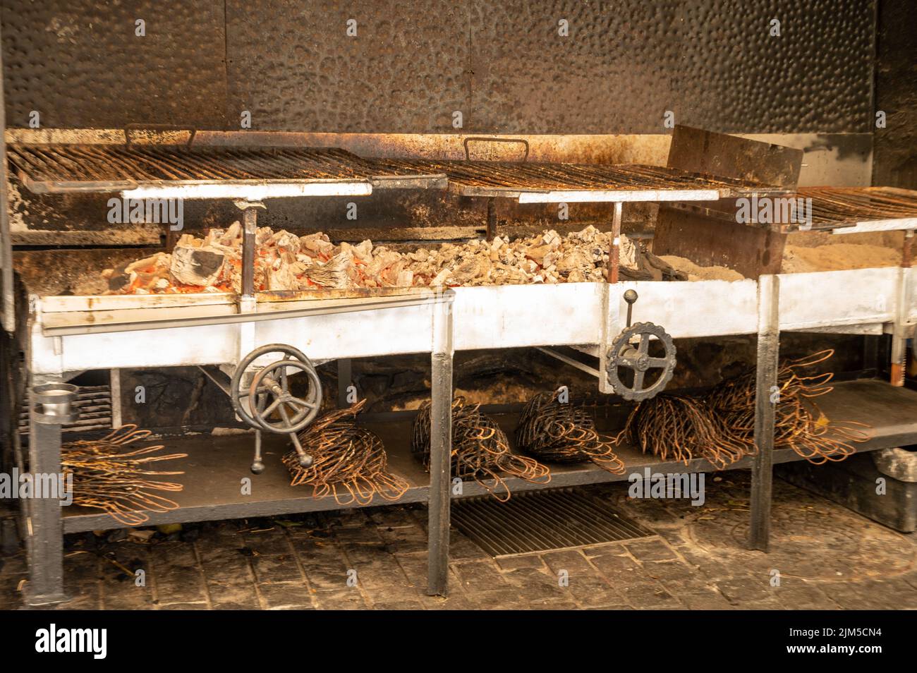 Old charcoal parrillas for fish grilling, build outside of buildings in ...