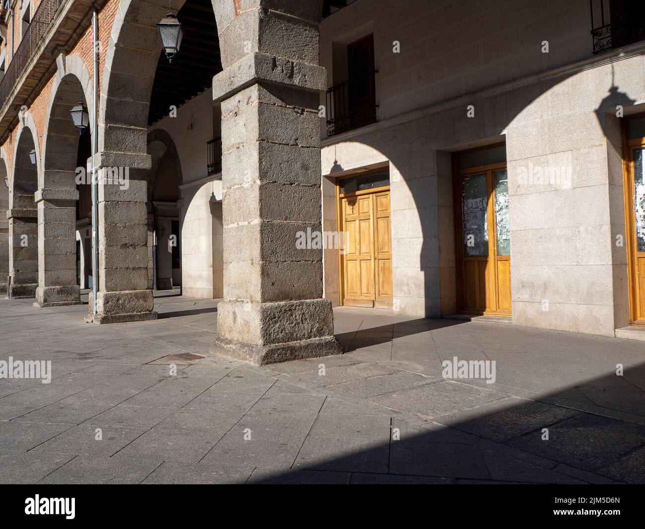 The columns with arches against the building wall under sunlight Stock ...
