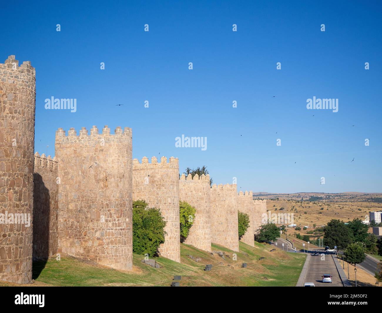 The Muralla de Avila historical place in Avila, Spain against blue sky ...