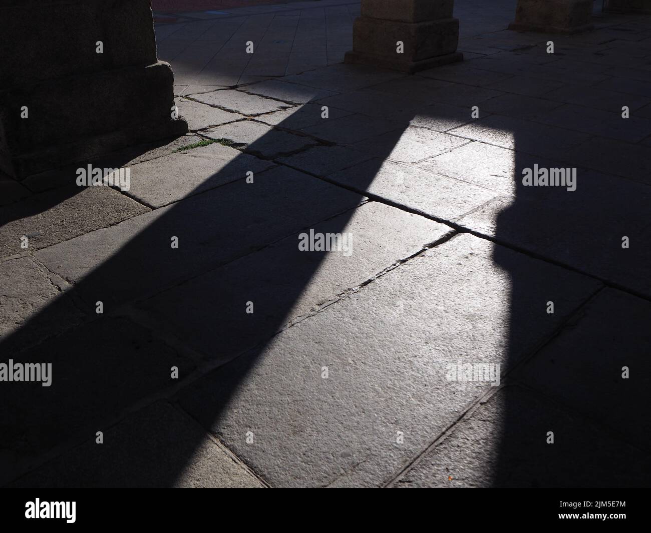 The shadows of columns on the stone ground Stock Photo - Alamy