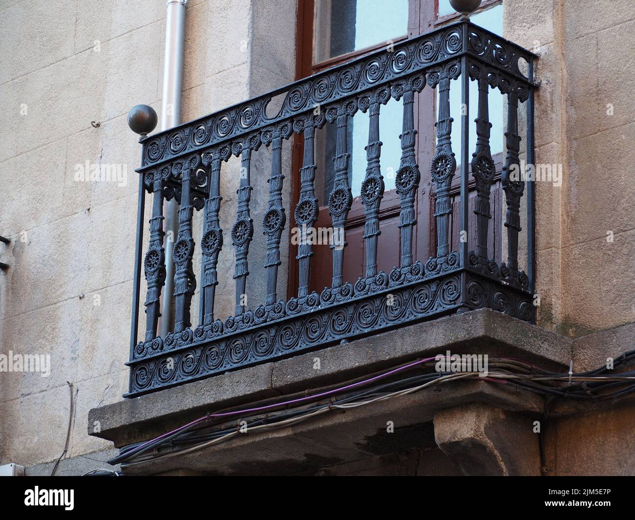 A forged iron balcony with railings Stock Photo - Alamy