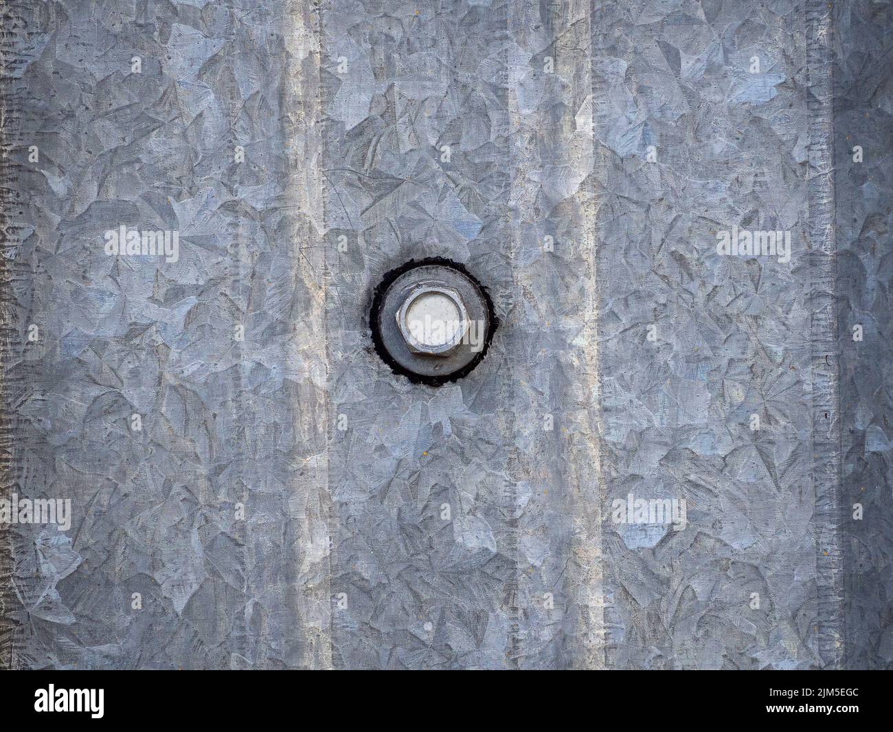 A closeup shot of zinc galvanized sheet of metal on a decorated wall ...