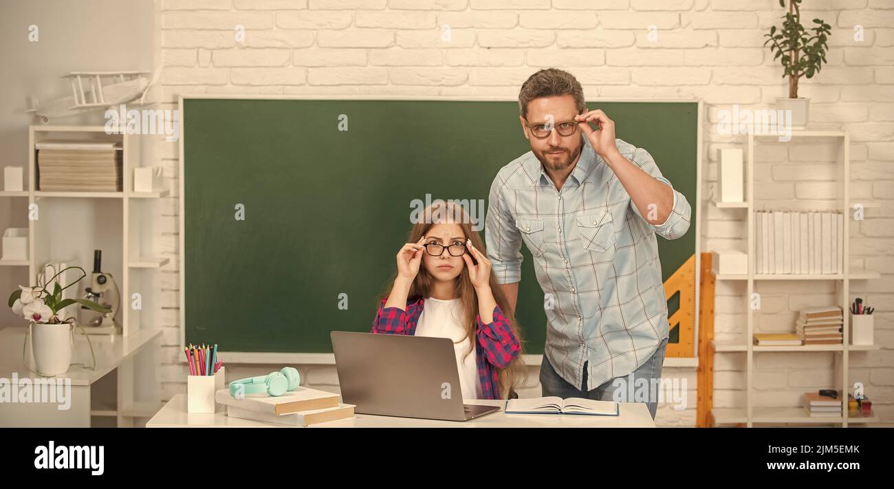 back to school. childhood education. nerd pupil and tutor with laptop ...