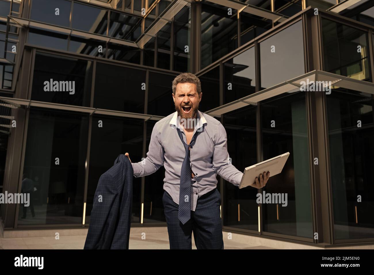 frustrated businessman man shouting in rage with computer and jacket ...
