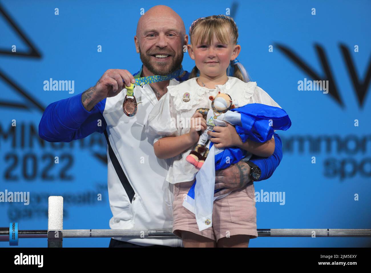 Scotland’s Micky Yule with his Bronze Medal looks on with his daughter ...