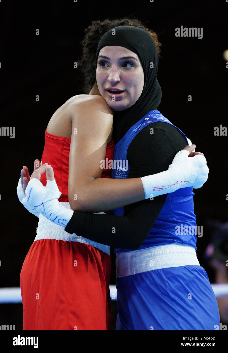 Australia's Tina Rahim (right) embraces England's Sameenah Toussaint ...