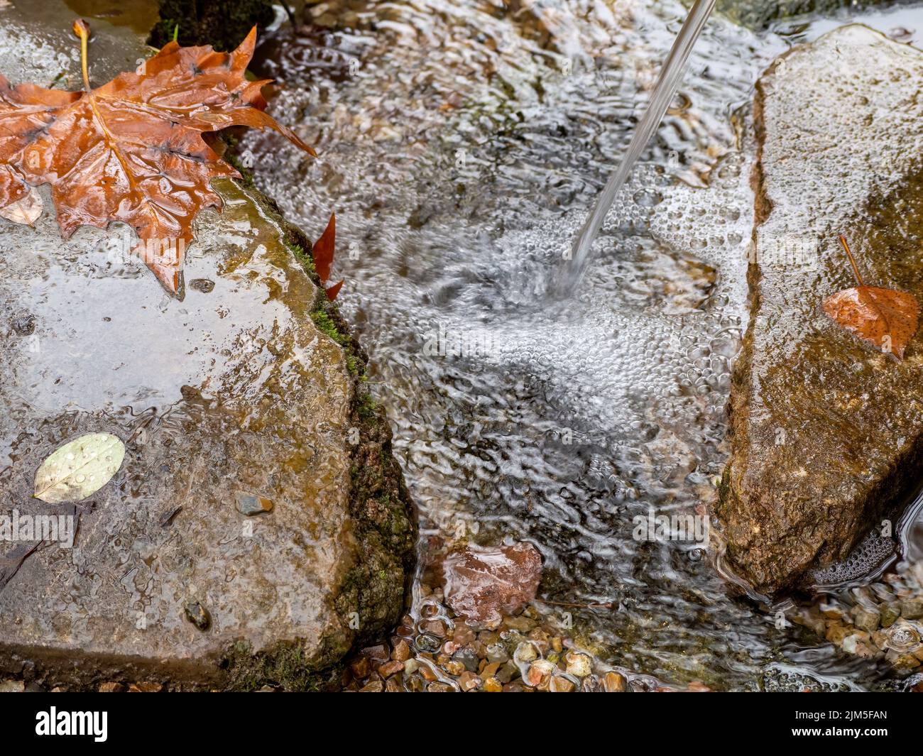 Pouring water from a tap into a glass hi-res stock photography and ...