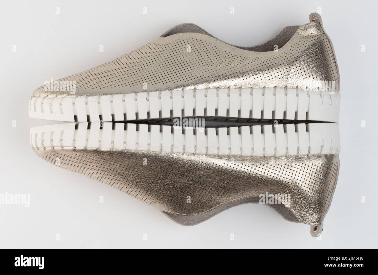 Pair of silver color shoes with white sole isolated Stock Photo - Alamy