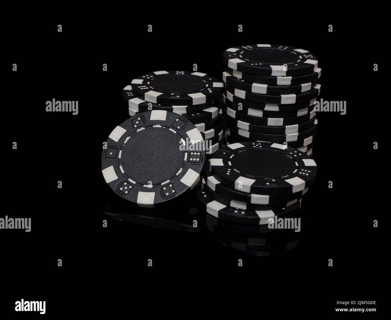 Black poker chips on a black background with space for text Stock Photo ...