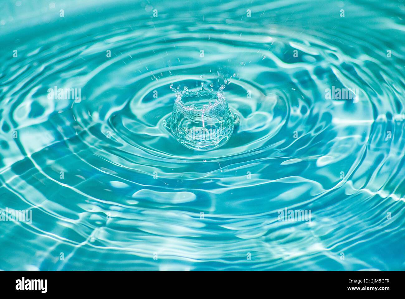 The splash of blue water with drops for background Stock Photo - Alamy