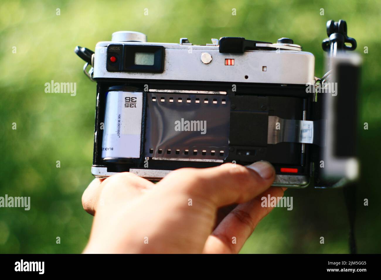Hand holding rear view analog camera with negative film on in Stock ...