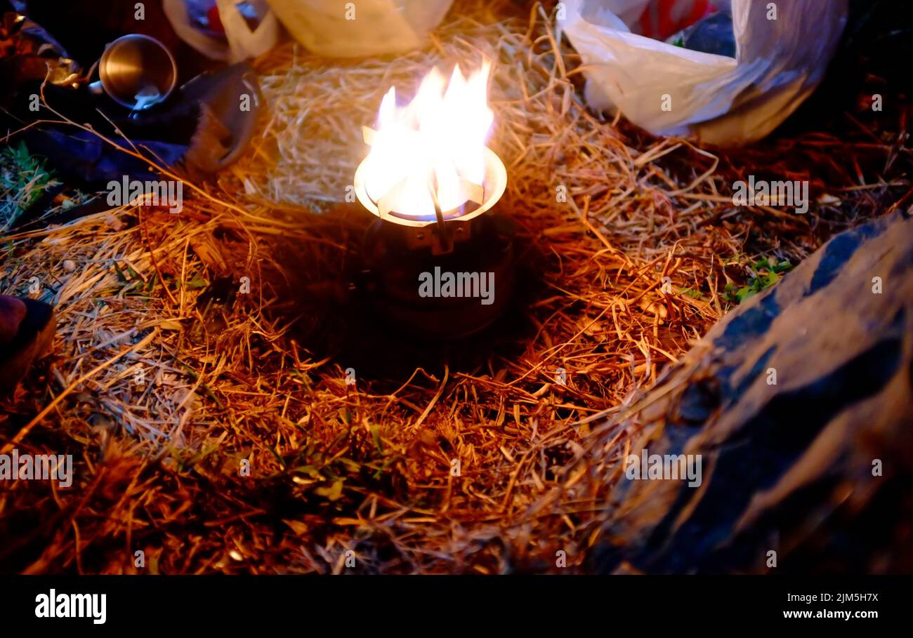 Close up burning camp gas on dried grass at night Stock Photo - Alamy