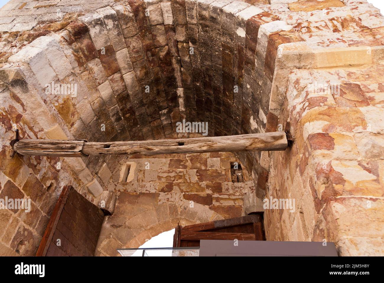 A low angle shot of the arch design of passage and door in the Old ...
