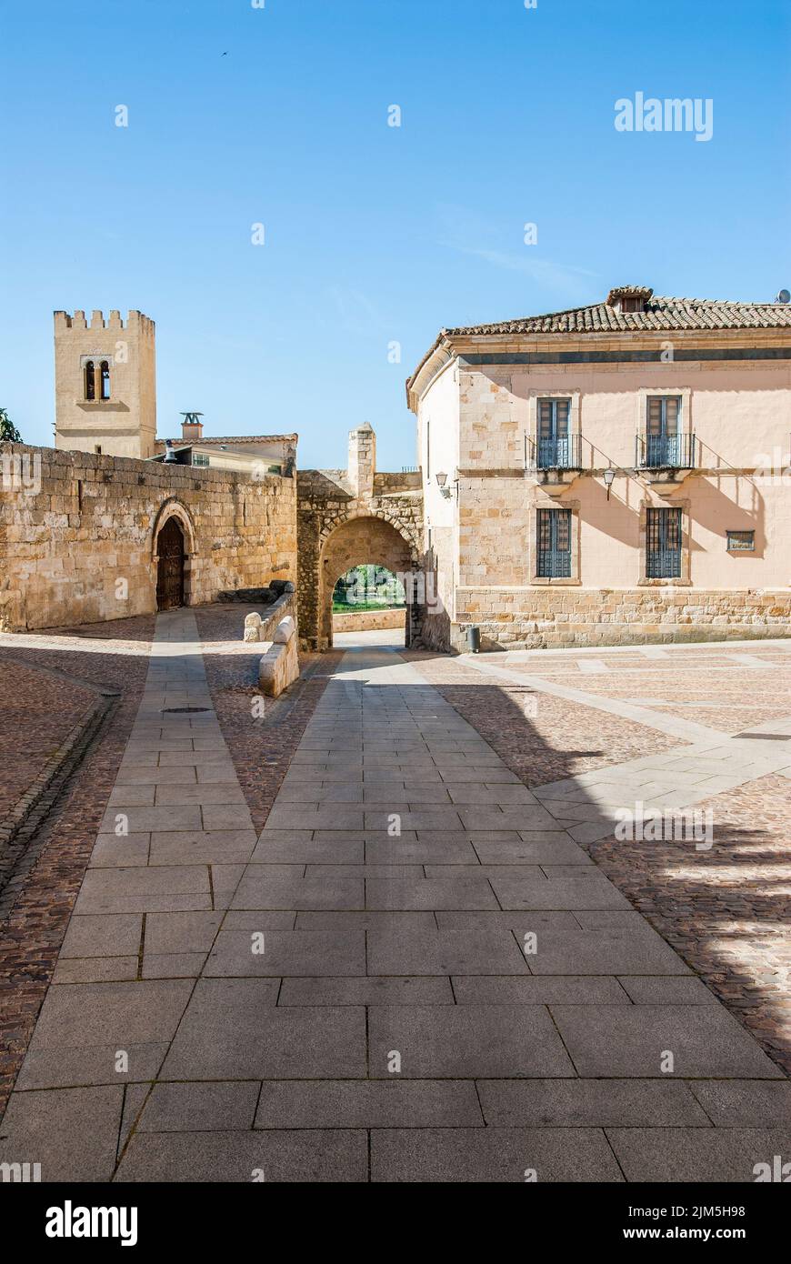 A vertical shot of a passage with building in an Old medieval castle ...
