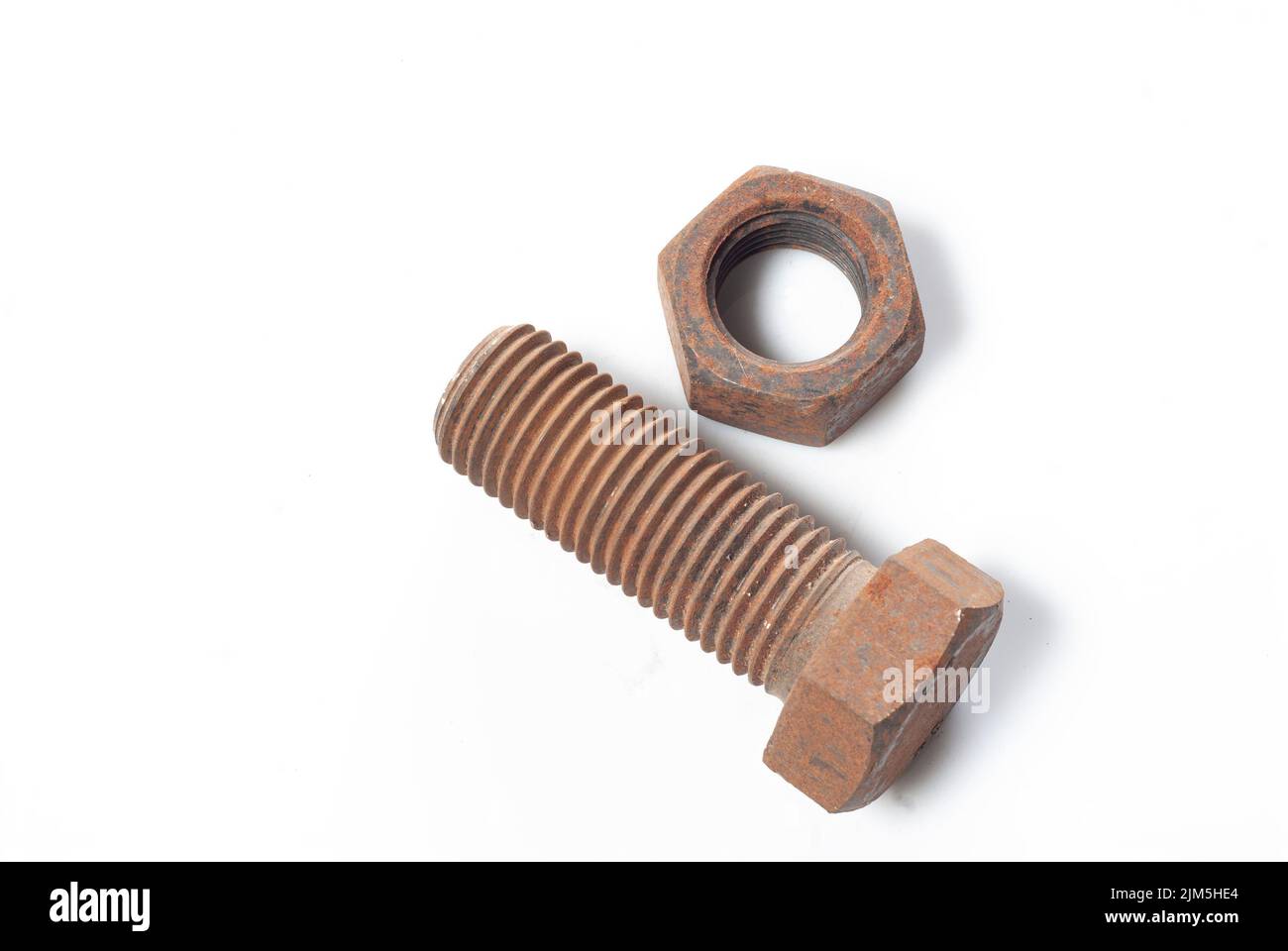 A Close-up of Old rusty nut and bolt isolated on white background Stock ...