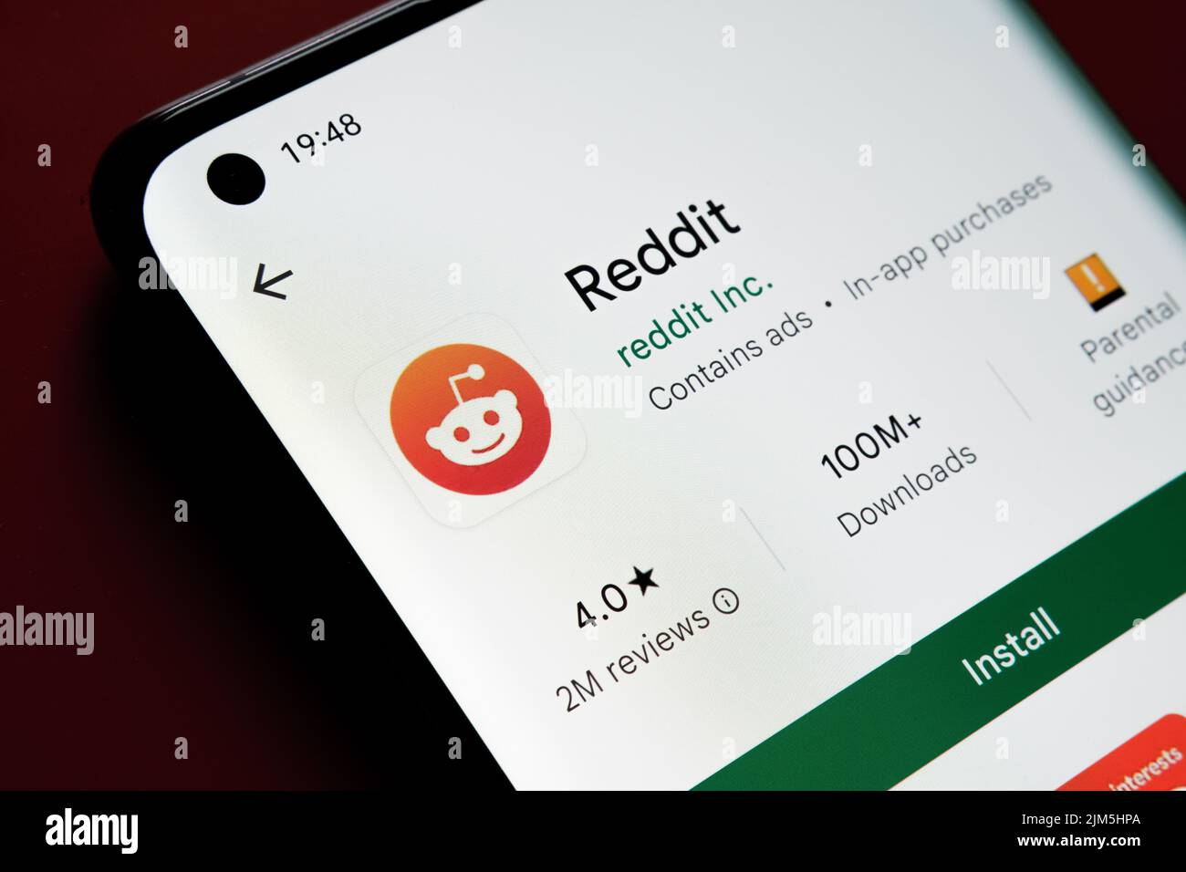 reddit app seen in Google Play Store on the smartphone screen placed on ...