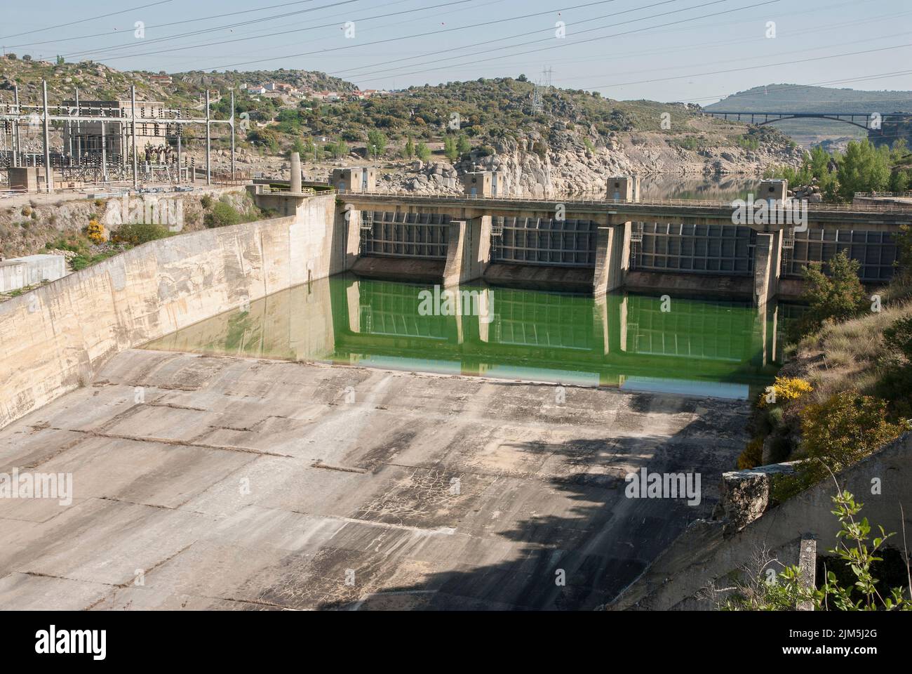 A horizontal shot of a Taintor door dam detaill on a background of Esla ...