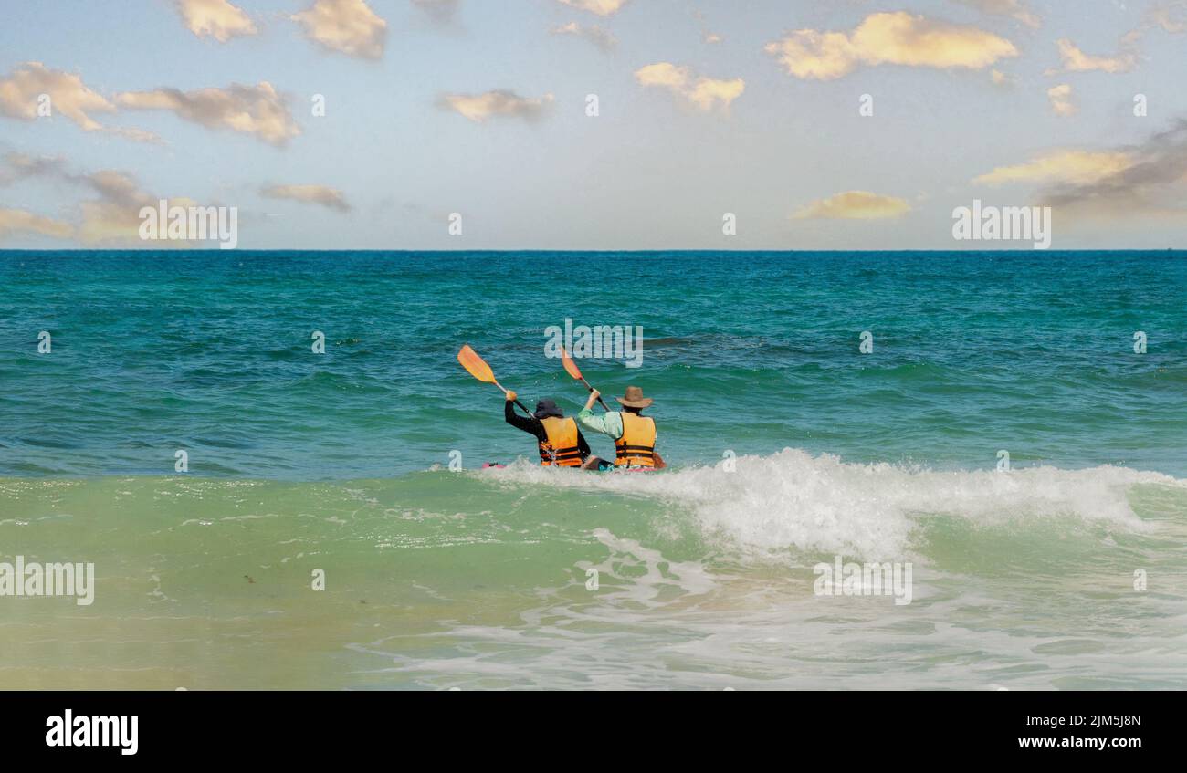 Two fellow kayakers went out in the evening to swim in a kayak in the ...