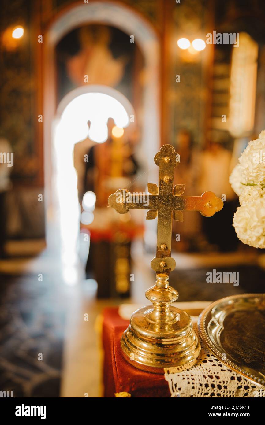 A selective of a golden cross in a church Stock Photo - Alamy