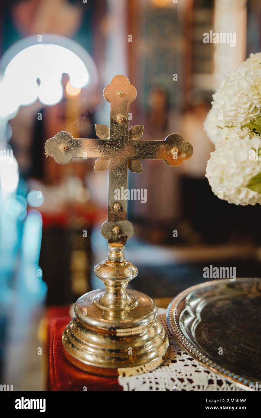 A selective of a golden cross in a church Stock Photo - Alamy