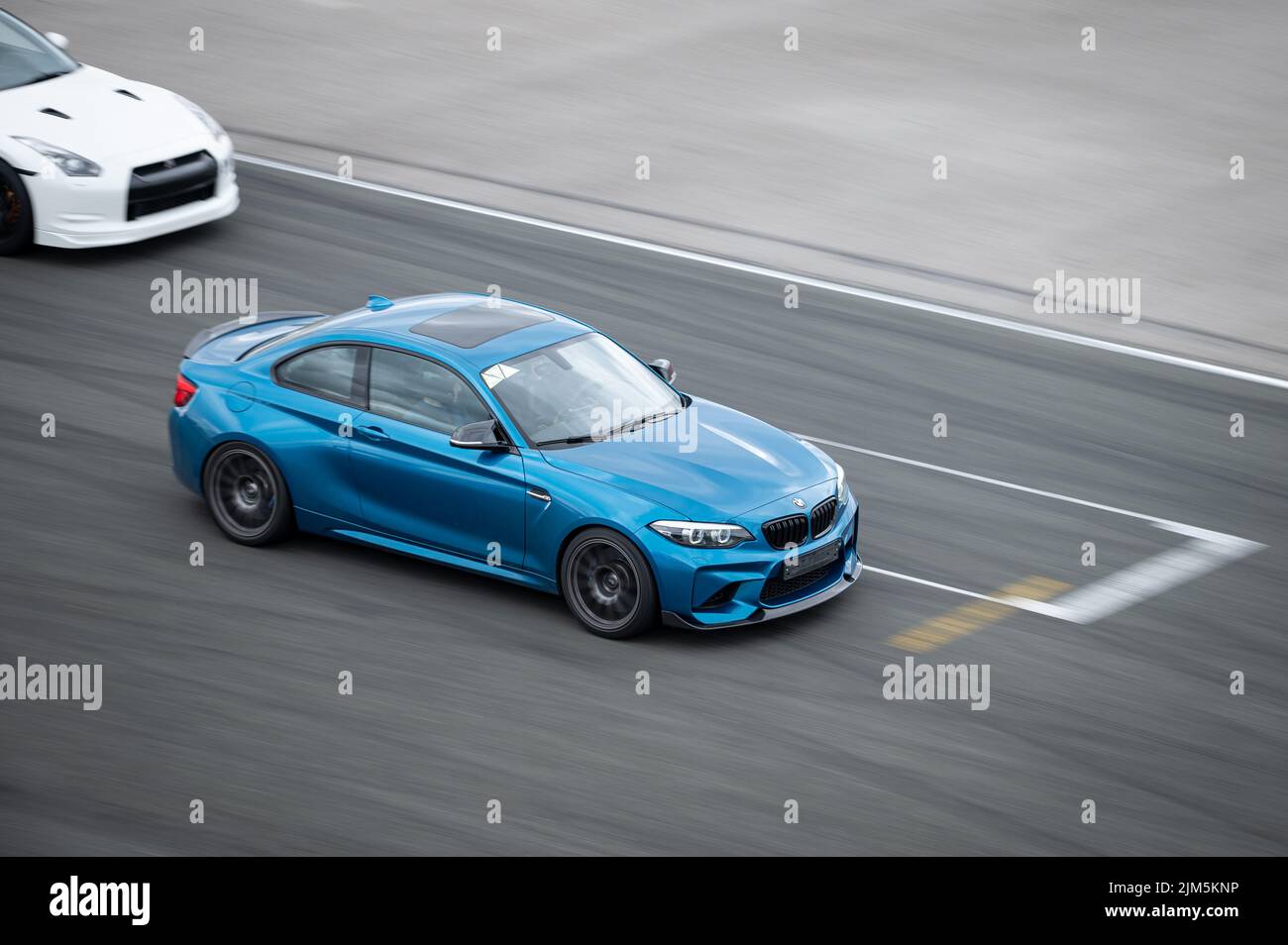 BMW F87 M2 racing on the circuit Stock Photo - Alamy