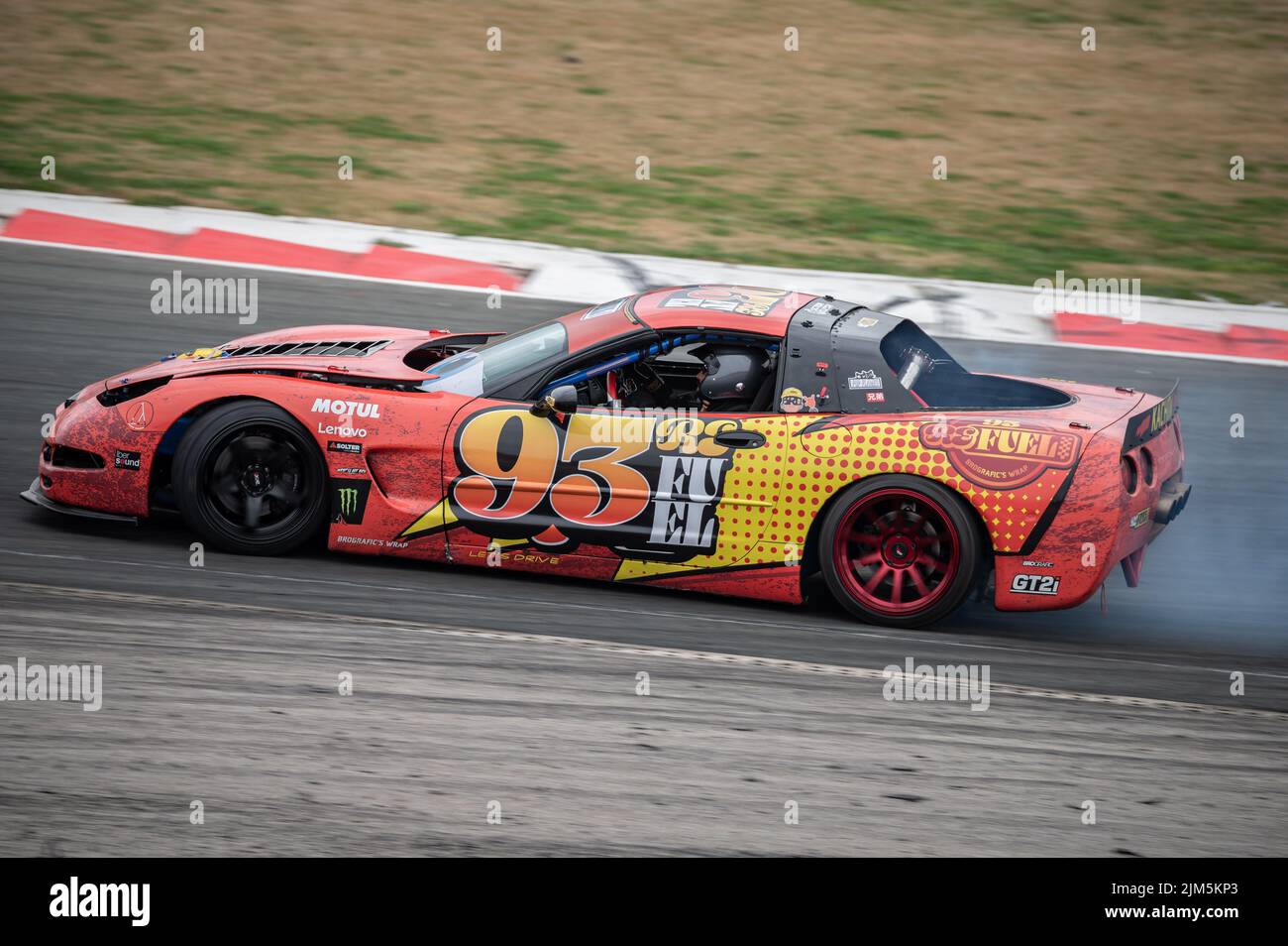 Red Chevrolet Corvette C5 drifting in the track Stock Photo - Alamy
