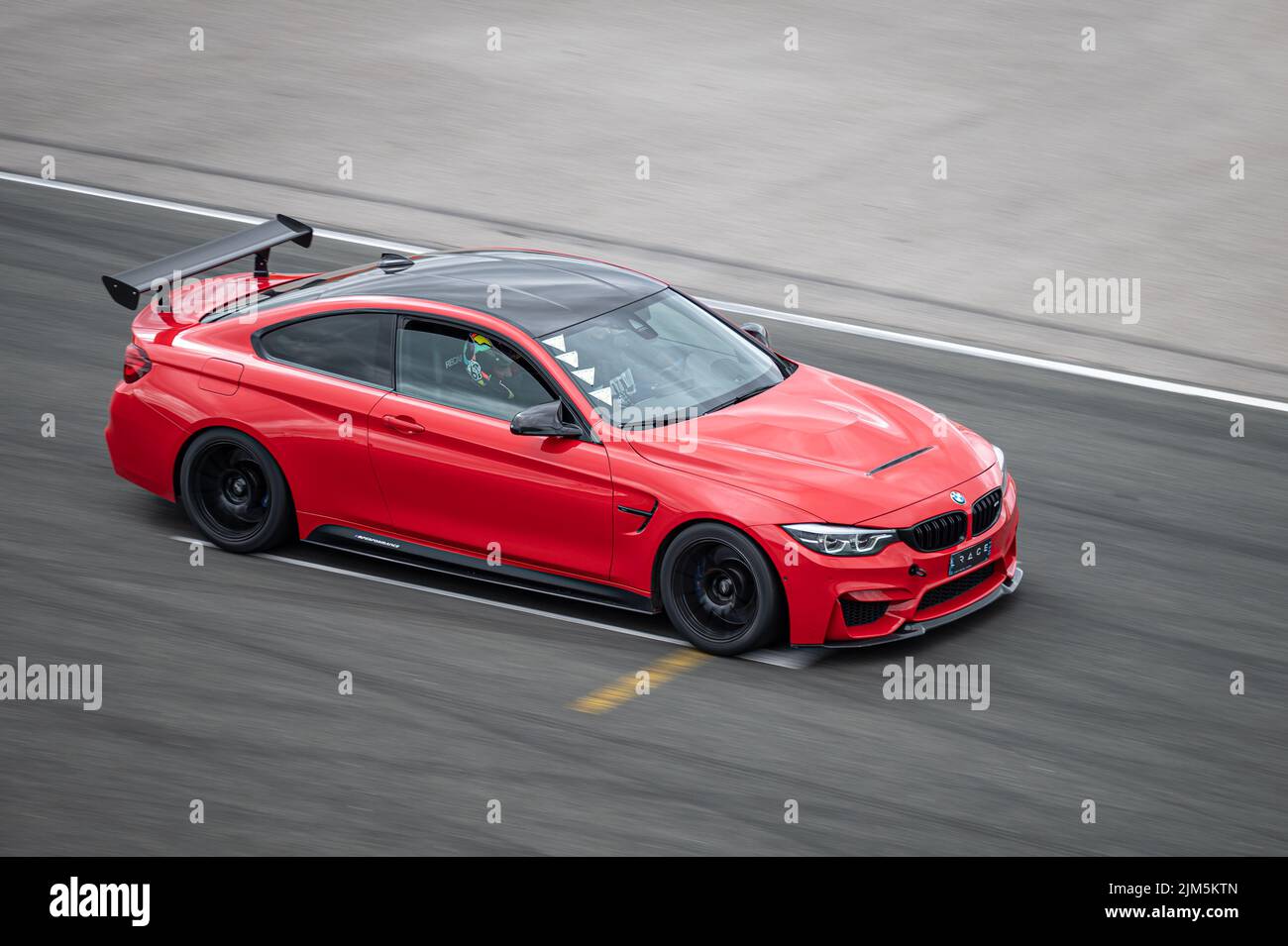 BMW F82 M4 GTS racing on the circuit Stock Photo - Alamy
