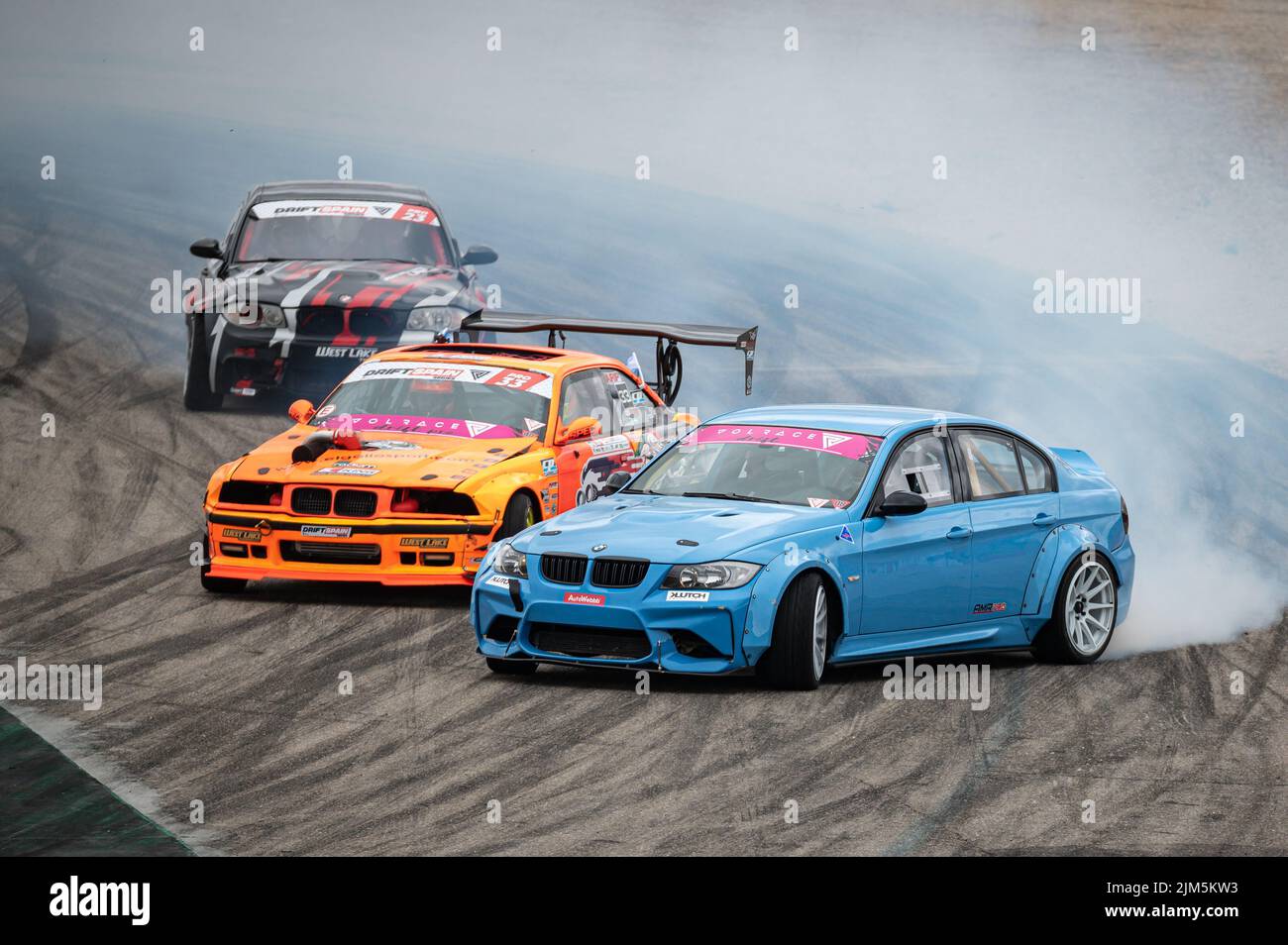 Bmw 3 Series E90 drifting on the circuit Stock Photo - Alamy