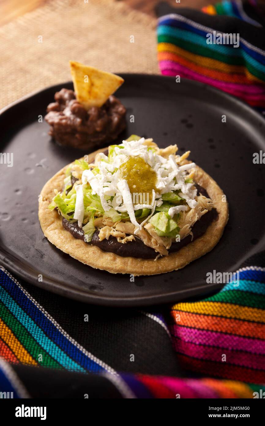 Sopes de Pollo. Traditional homemade Mexican appetizer prepared with ...