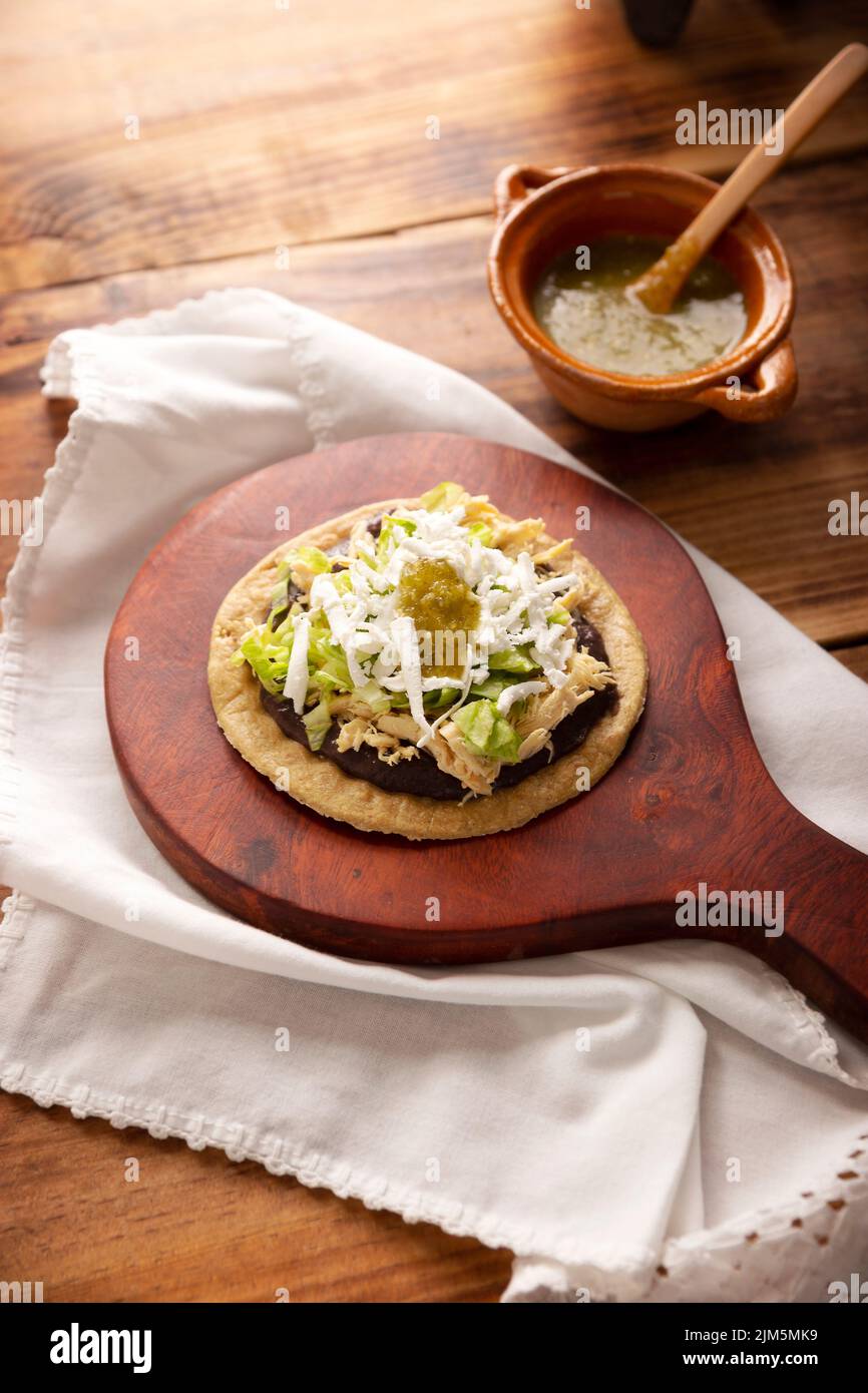 Sopes de Pollo. Traditional homemade Mexican appetizer prepared with ...