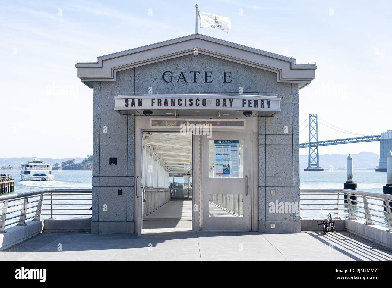 A San Francisco Bay Ferry Gate with a ferry and the San Francisco Bay ...