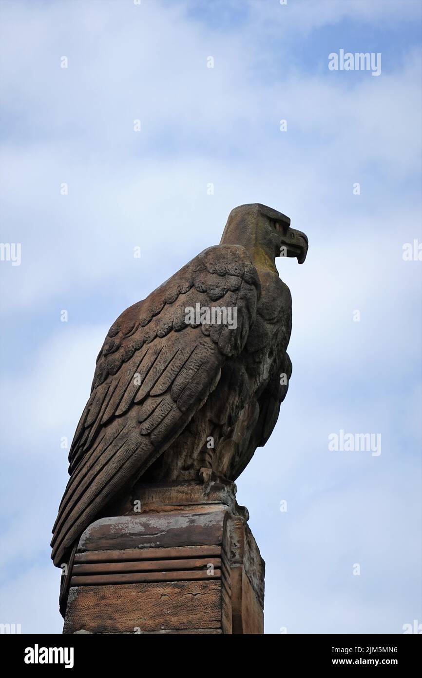 A vertical closeup shot of an eagle sculpture Stock Photo - Alamy