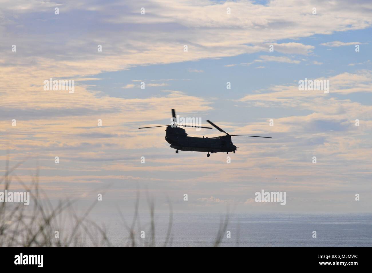 Chinook helicopters fly over Gwithian Beach and Godrevy lighthouse ...