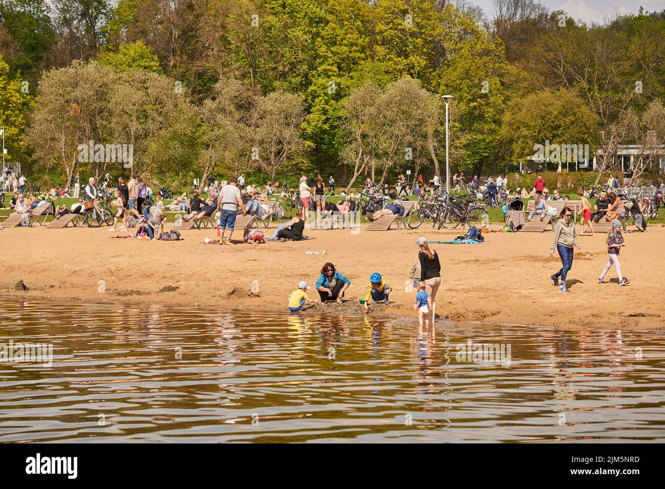 The people near the Rusalka lake on a sunny spring day in Poznan ...