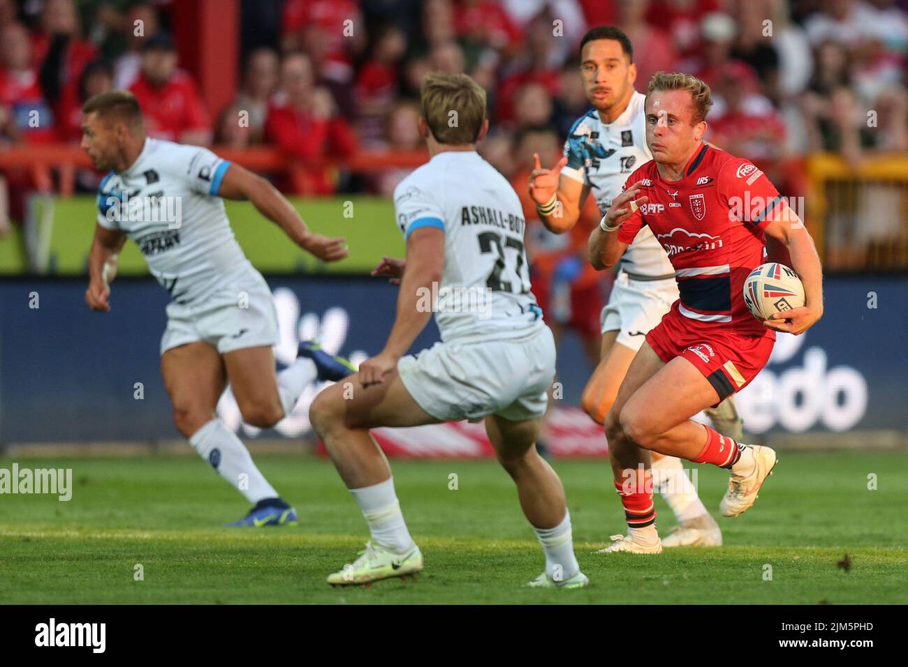 Jez Litten #14 of Hull KR runs at Olly Ashall-Bott #27 of Toulouse ...