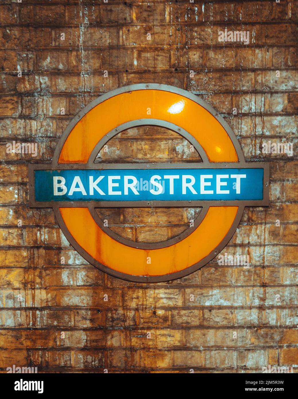 Baker Street sign attached to a rustic brick wall Stock Photo - Alamy
